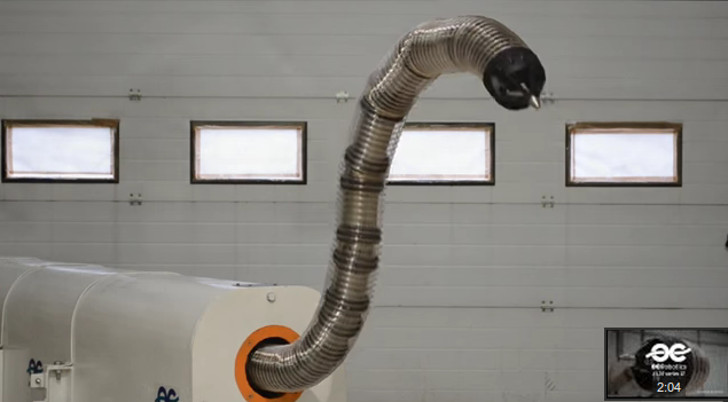 Watch Tesla's Snake Charger Slither into and Recharge an Electric Car