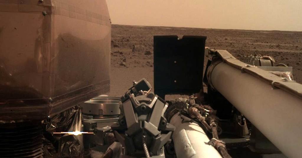 NASA's InSight Mars Lander Fires up Solar Cells and Sends Selfie