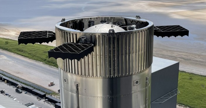 SpaceX Lifts Massive Starship Booster Onto Launchpad