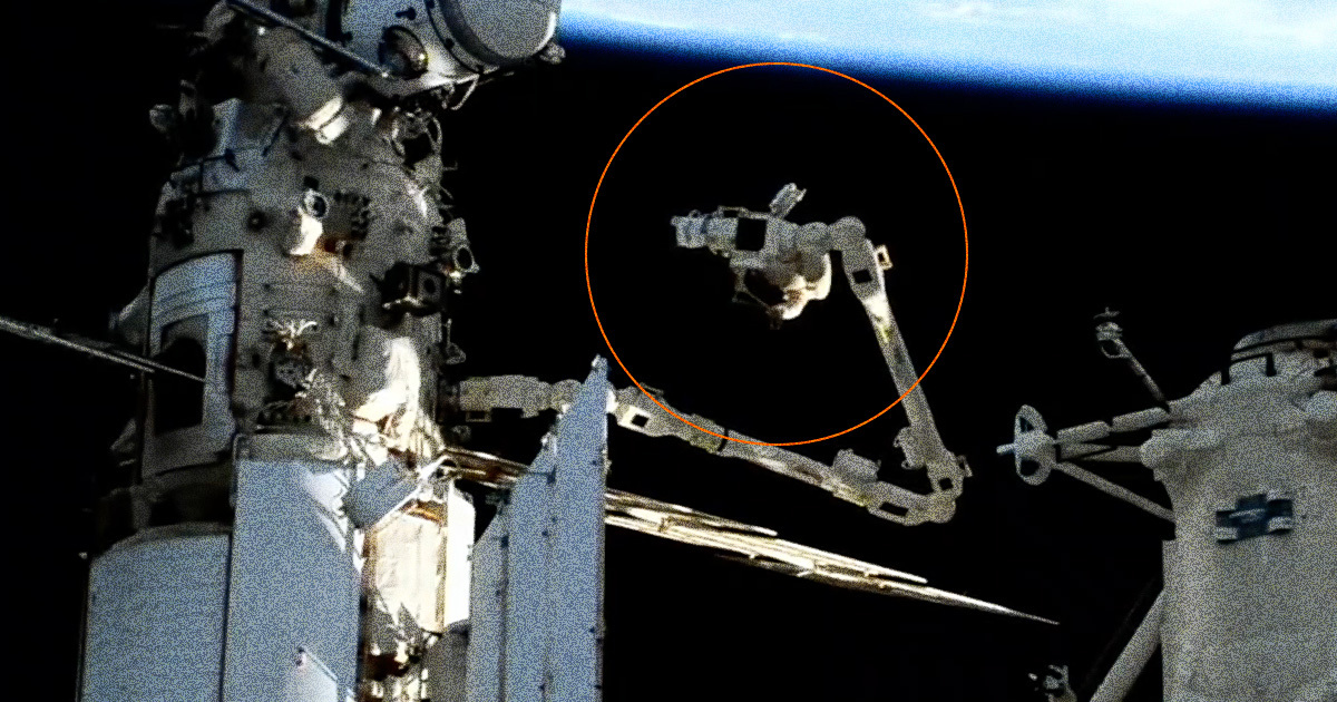 Cosmonaut Ghost Rides 37-Foot Robotic Arm Outside Space Station