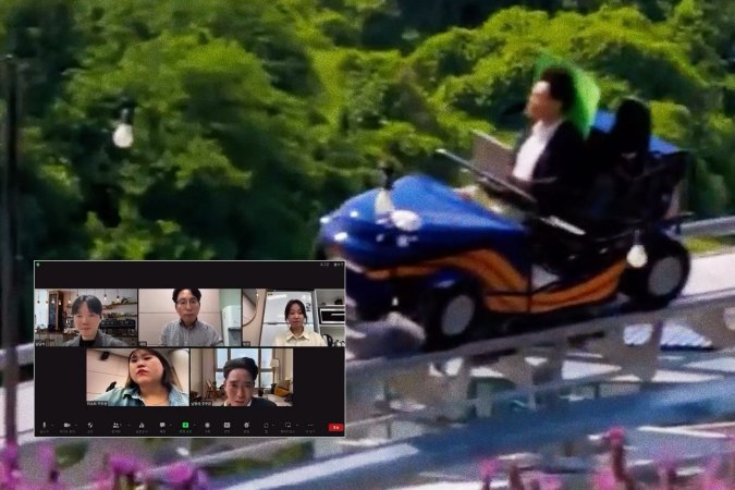 Man Attends Video Meeting From Active Roller Coaster